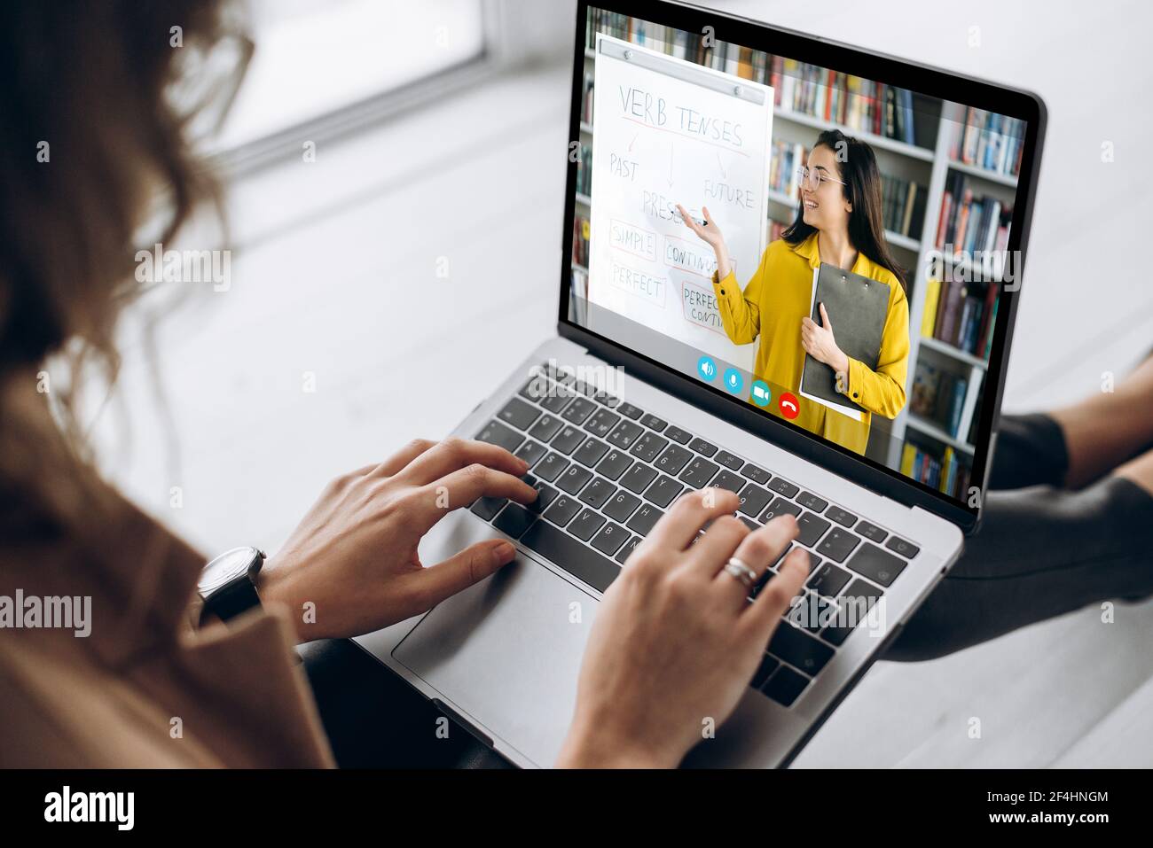 Distance learning by video conference. Female student uses video call ...