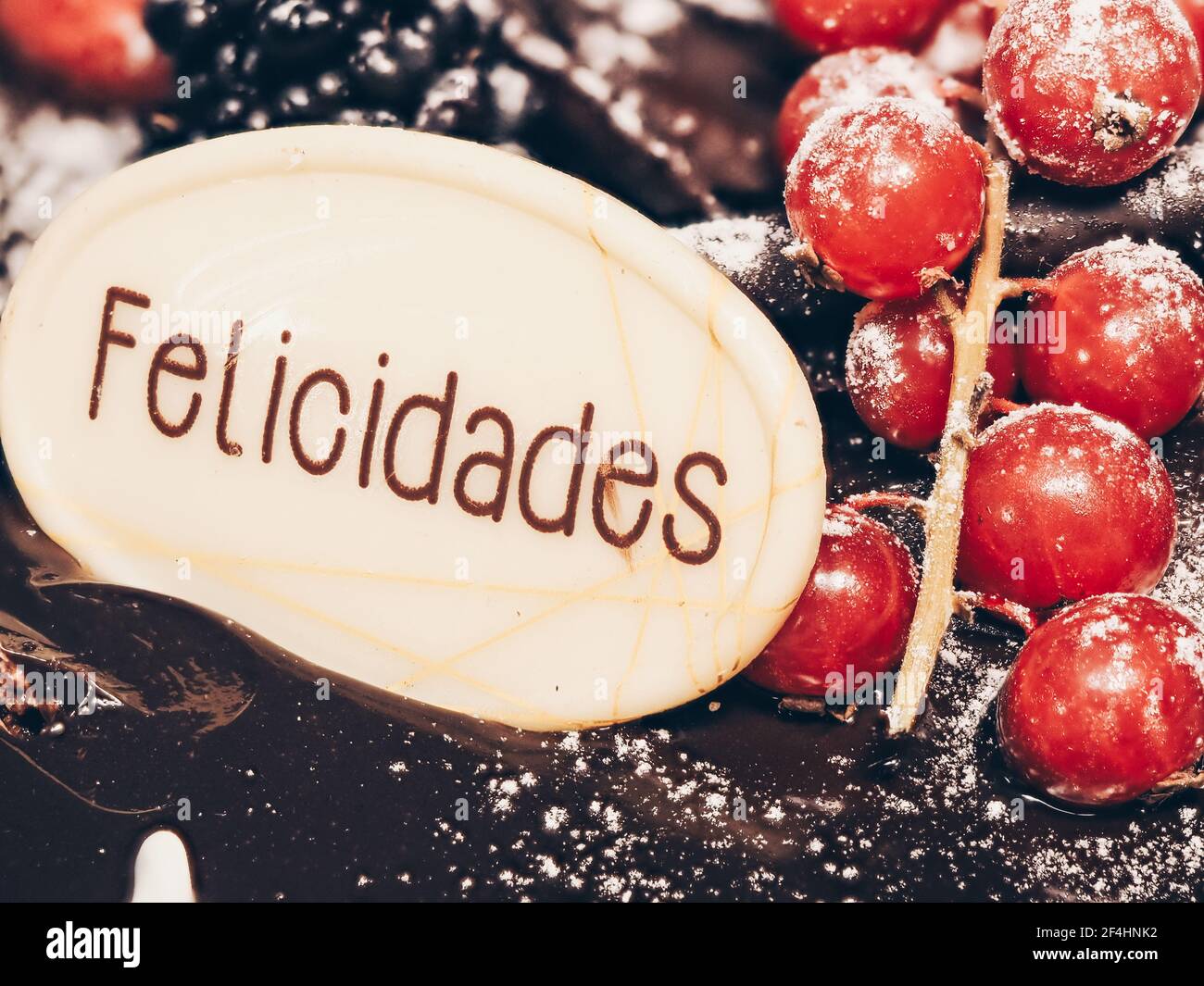 A closeup of a delicious chocolate birthday cake with a ...
