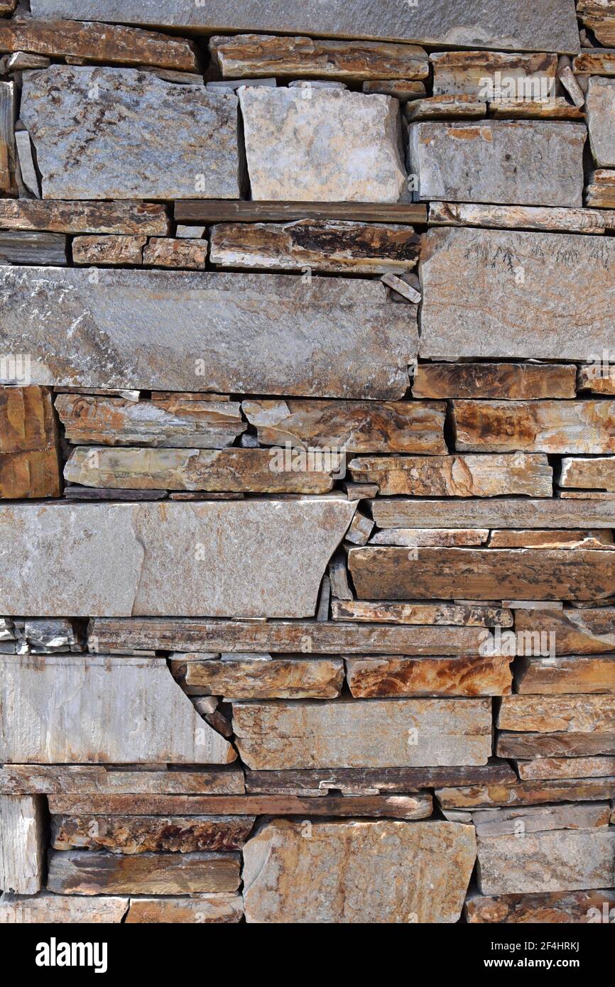 Flagstone wall as a textured background Stock Photo - Alamy