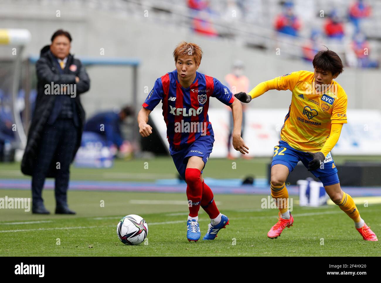 Ajinomoto Stadium, Tokyo, Japan. 21st Mar, 2021. (L to R) Hirotaka Mita (FC Tokyo), Ryoma Kida ...
