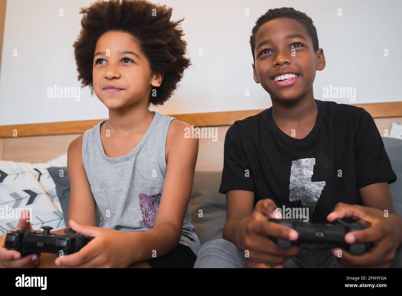 Two brothers playing video games at home Stock Photo - Alamy