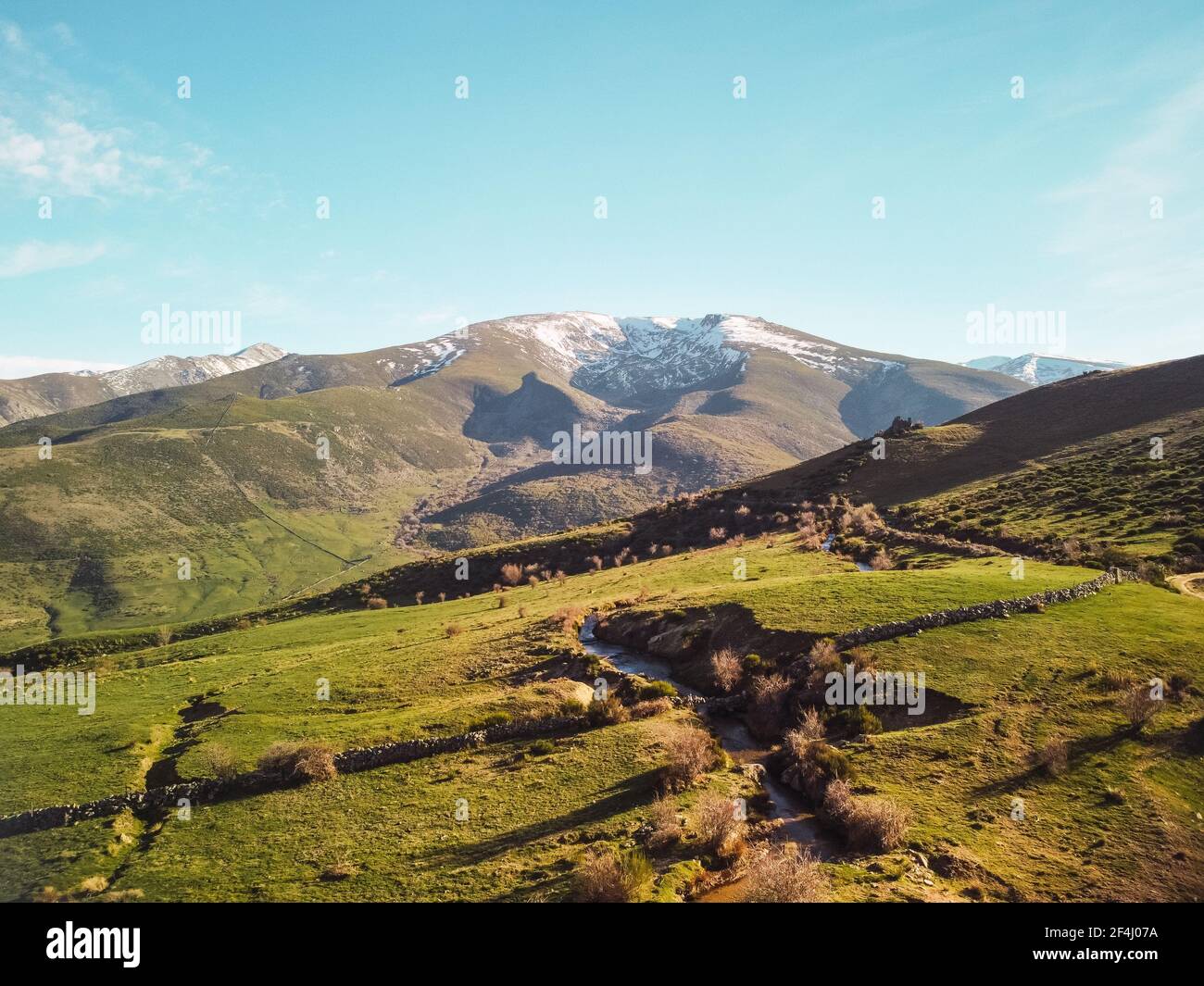 Beautiful country landscape with green-covered mountains and meadows ...