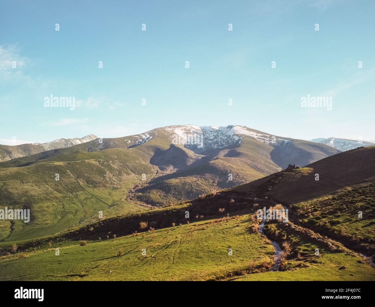 Beautiful country landscape with green-covered mountains and meadows ...