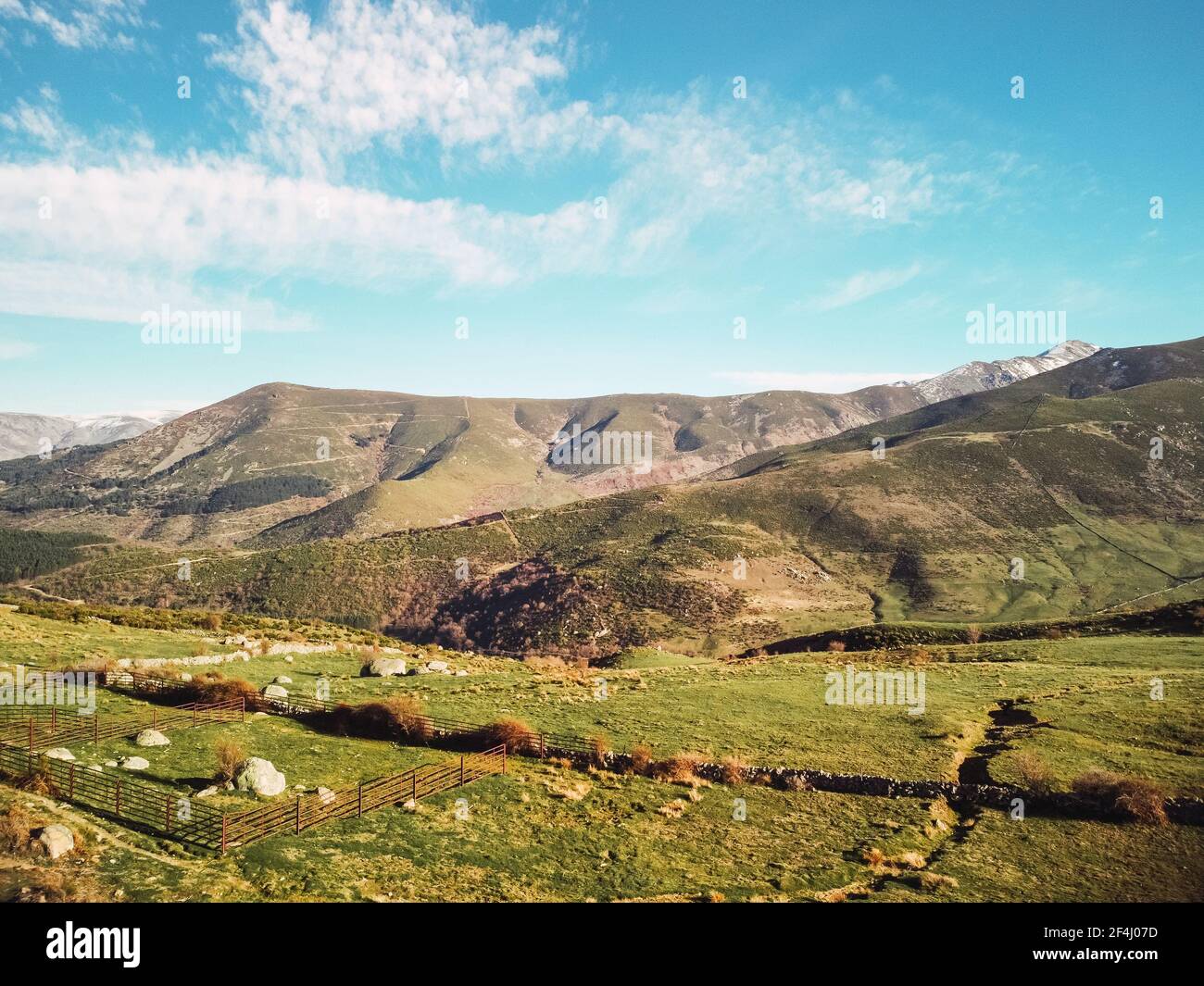 Beautiful country landscape with green-covered mountains and meadows ...
