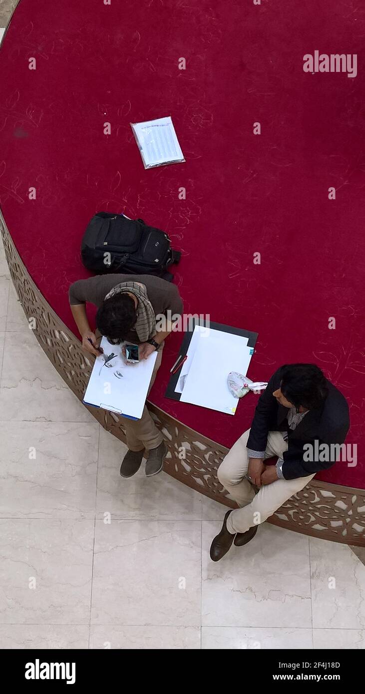 basra, iraq- march 16, 2017: top photo of art sketcher in times squqre ...