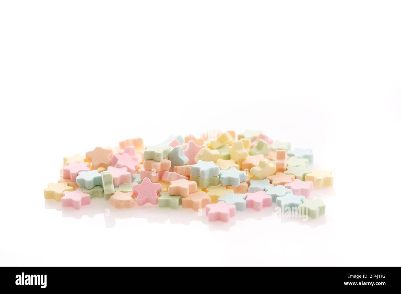 Colourful Star Milk pellets isolated in white background Stock Photo ...