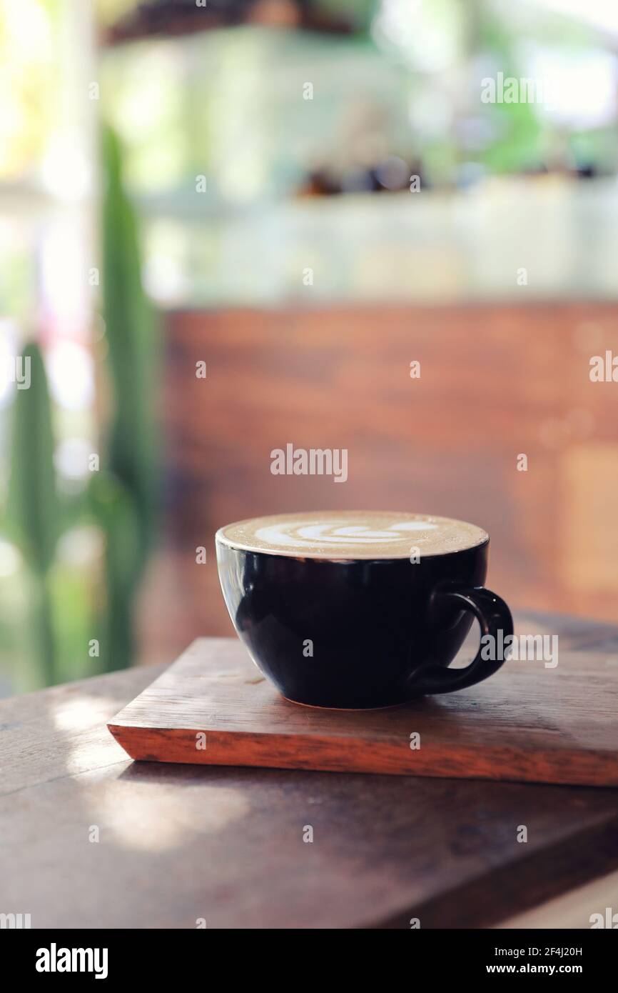Cappuccino coffee break on wood background Stock Photo - Alamy