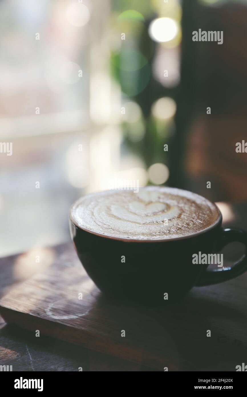 Cappuccino coffee break on wood background Stock Photo - Alamy