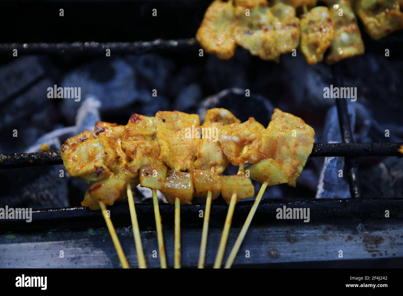 Delicious chicken roasting on grill hi-res stock photography and images ...