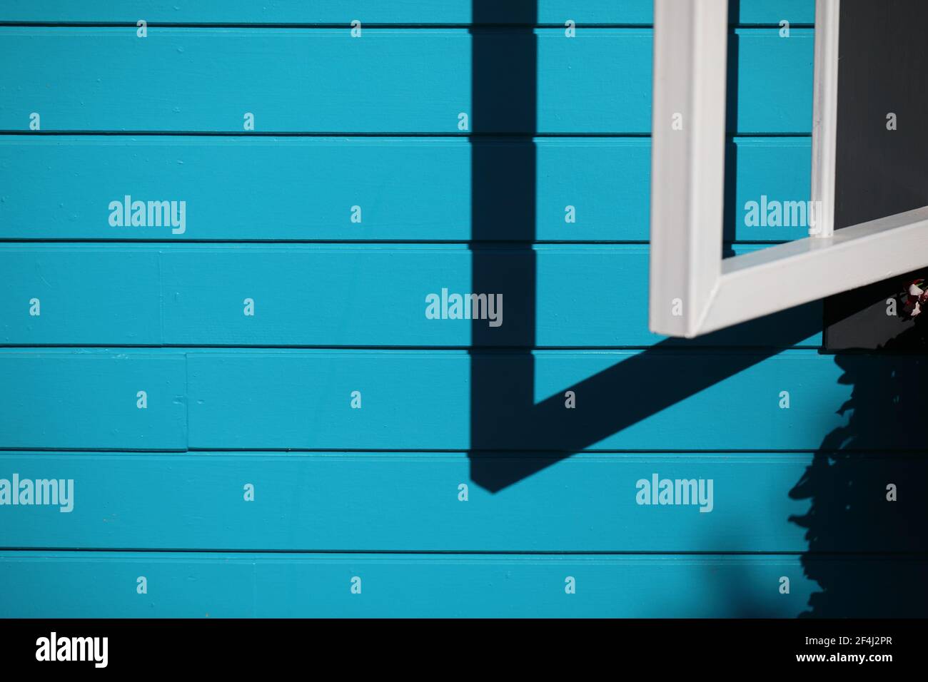 Blue wall with window Stock Photo - Alamy