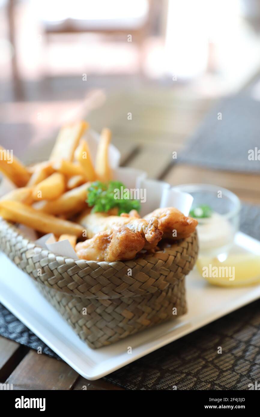 Fish and chips in close up on wood table background Stock Photo - Alamy