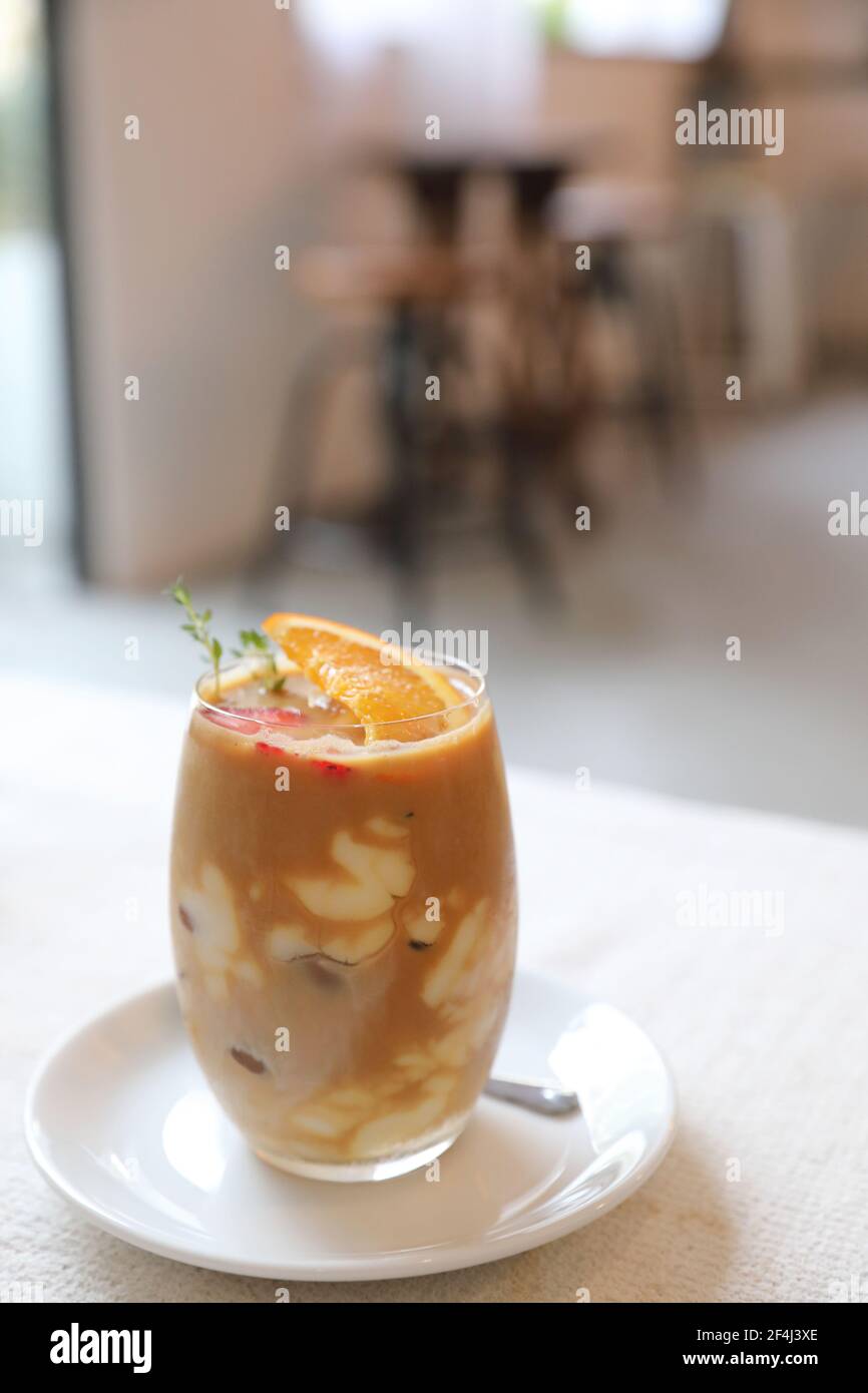Iced Coffee latte with orange mix in close up Stock Photo - Alamy