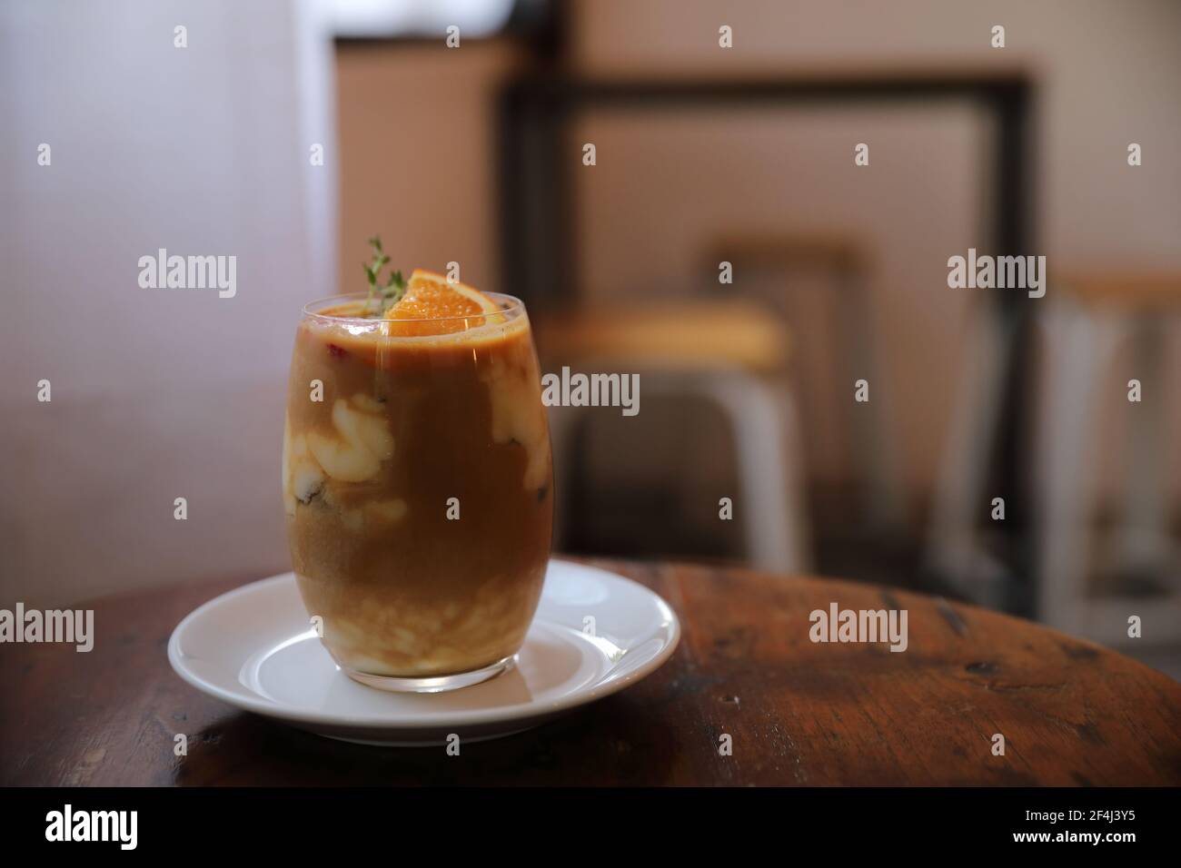 Iced Coffee latte with orange mix in close up Stock Photo - Alamy