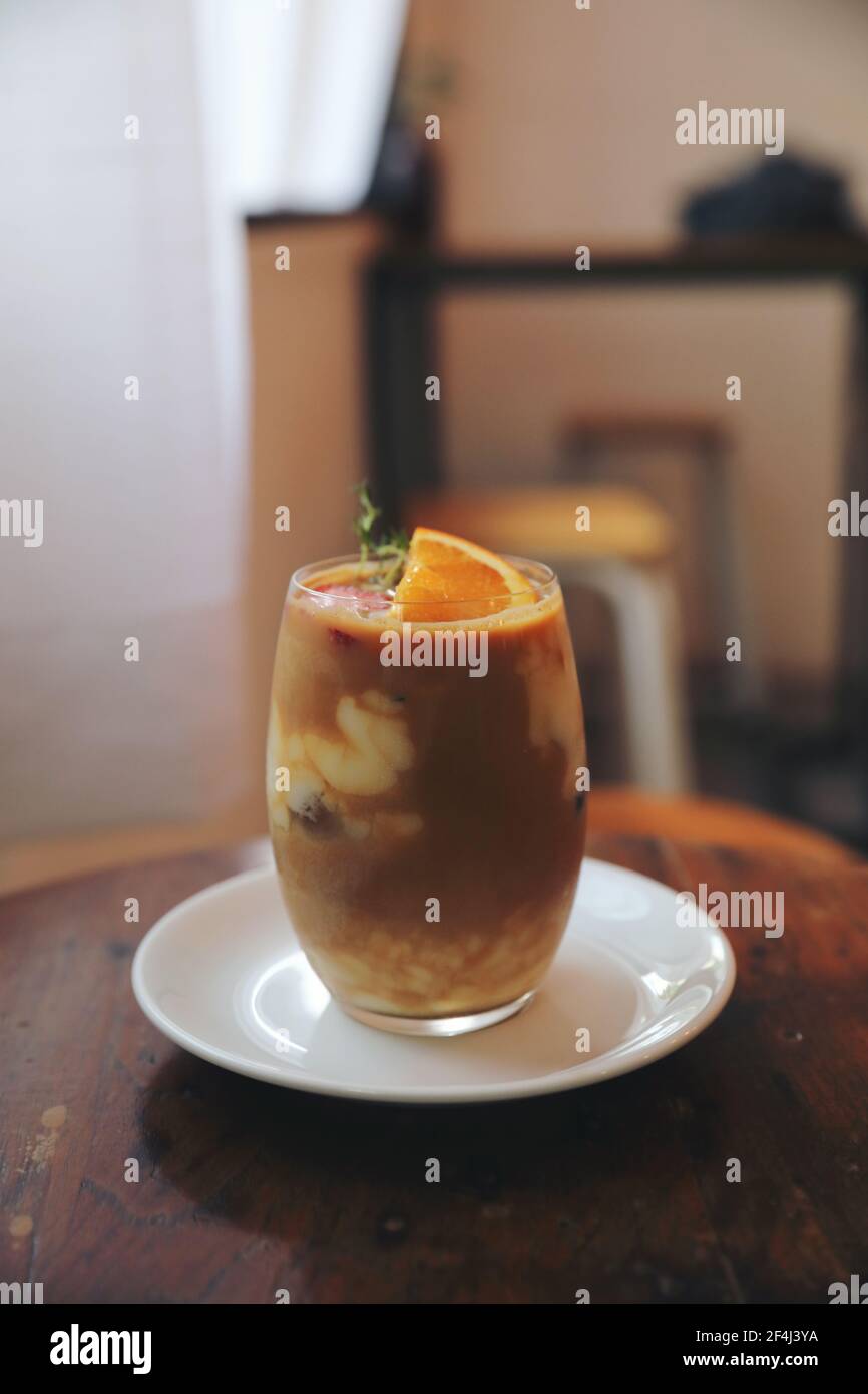 Iced Coffee latte with orange mix in close up Stock Photo - Alamy