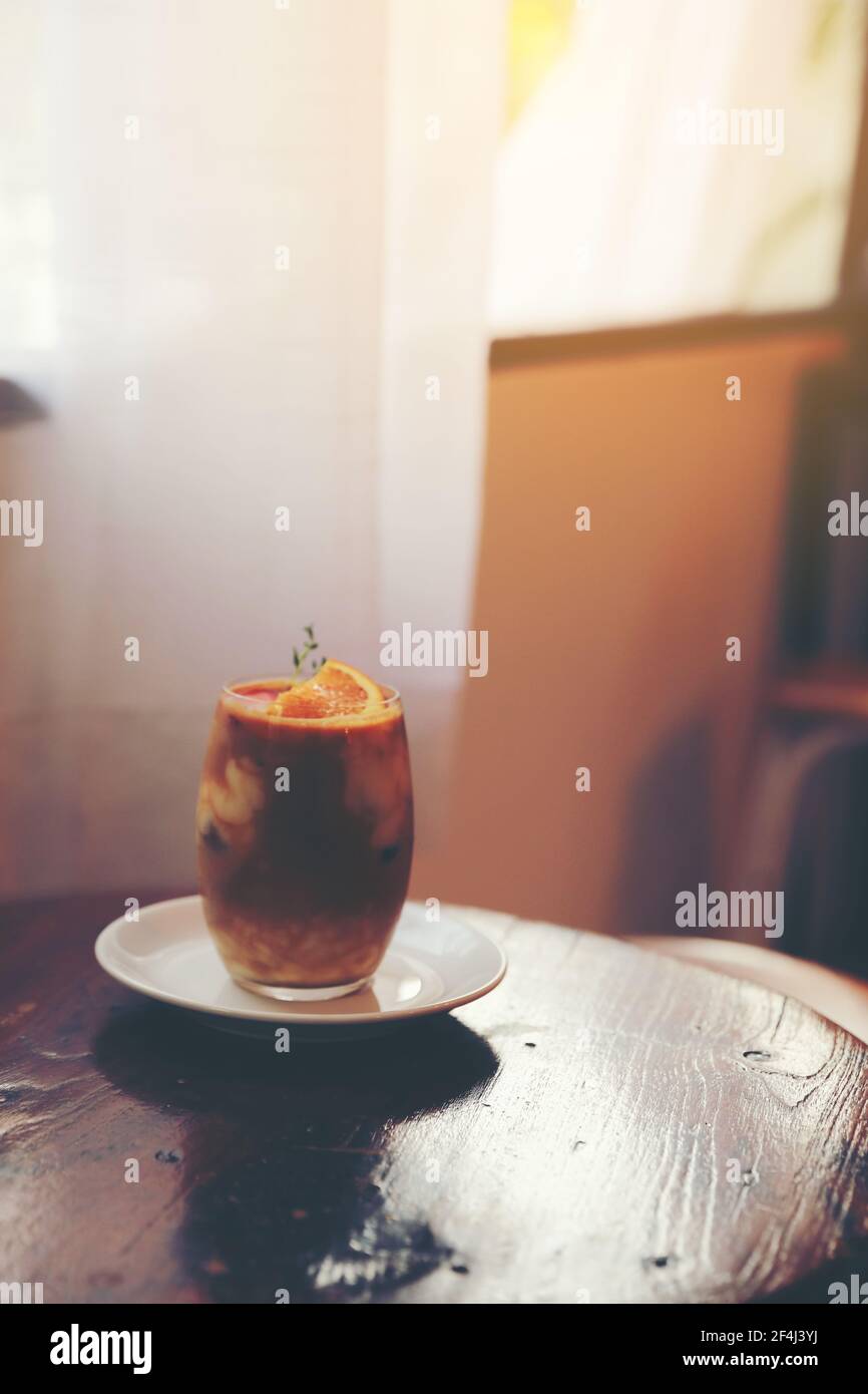 Iced Coffee latte with orange mix in close up Stock Photo - Alamy
