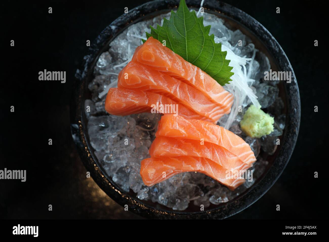 Salmon sashimi on ice Japanese food Stock Photo - Alamy