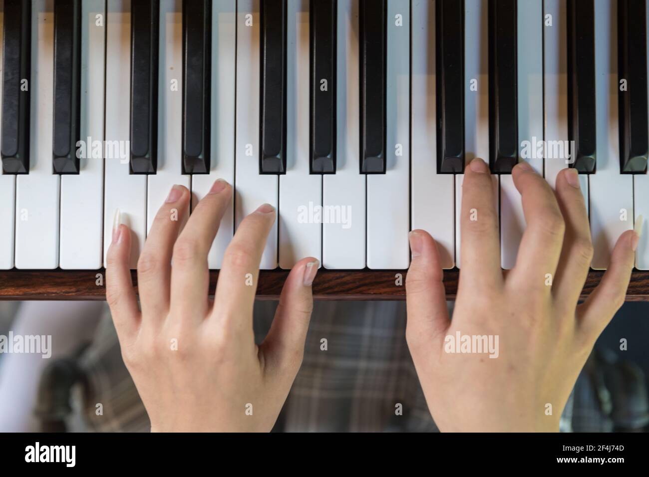 Hands playing classical piano hi-res stock photography and images - Alamy