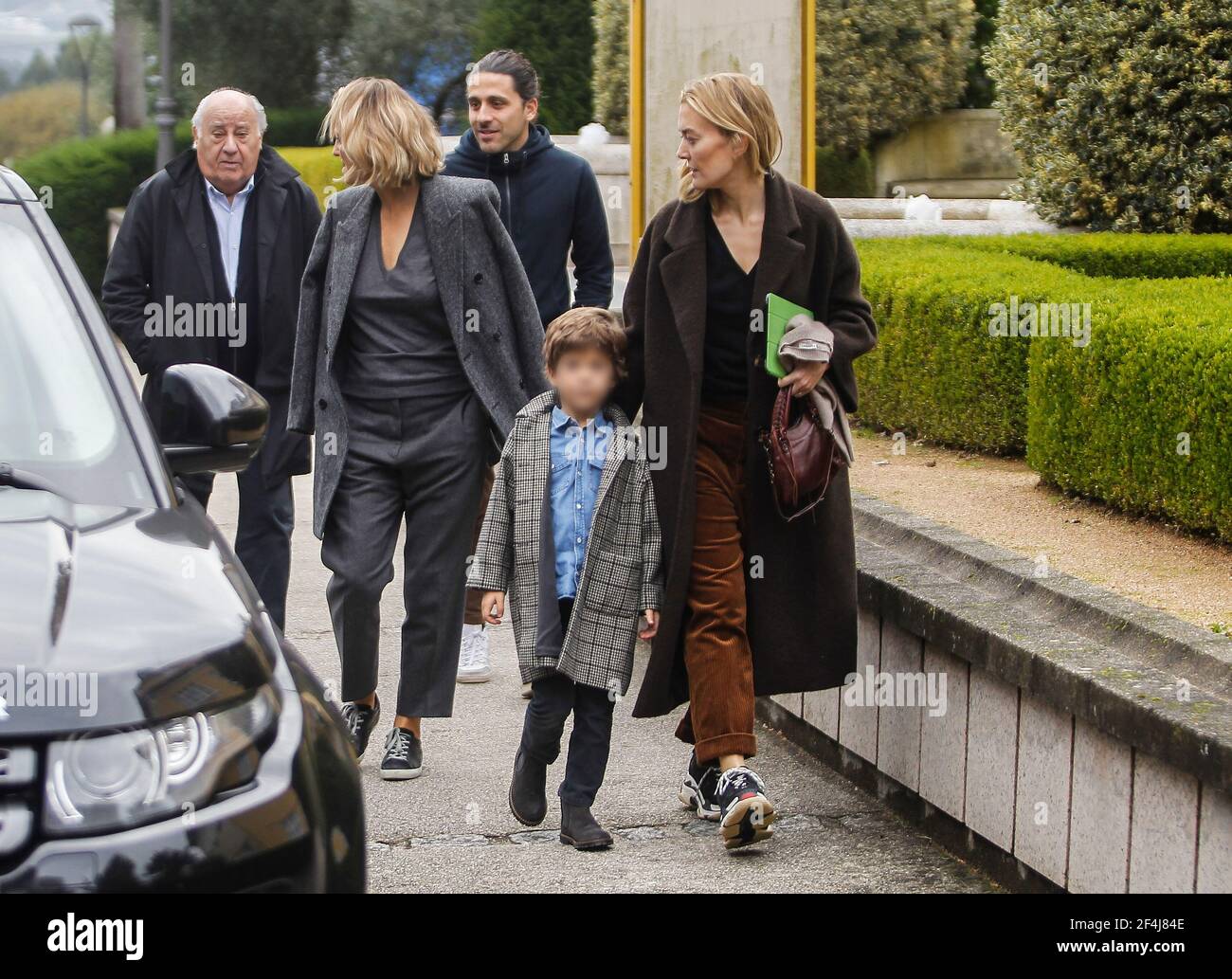 Coruna-Spain. Amancio Ortega (founder of Zara) with his family walking ...