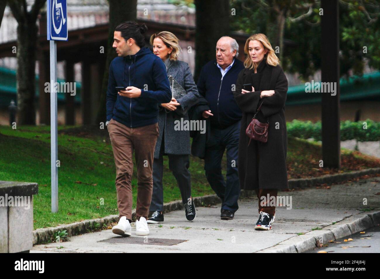 Coruna-Spain. Amancio Ortega (founder of Zara) with his family walking ...