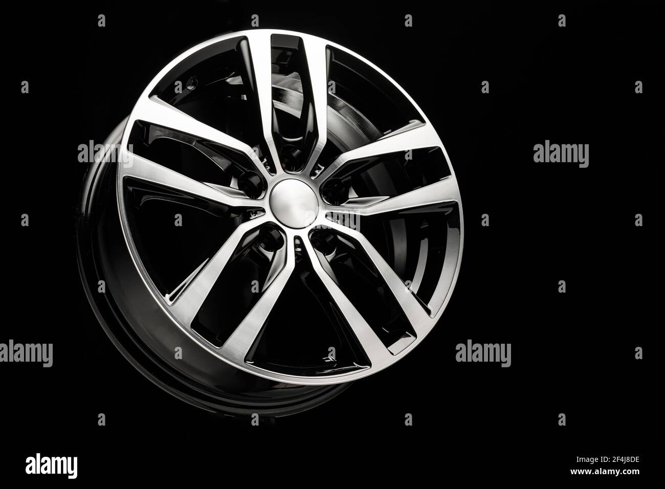 beautiful black alloy wheel on black background Stock Photo - Alamy