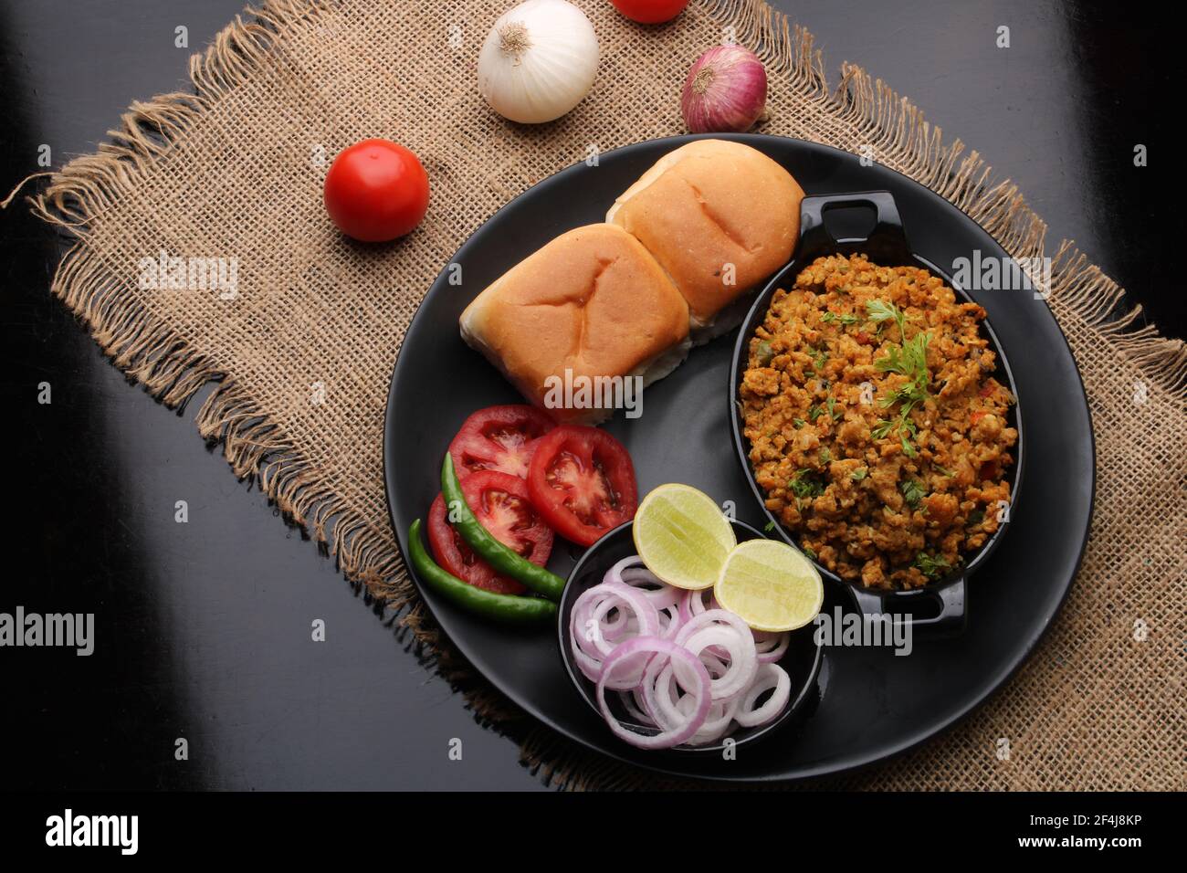 Masala Anda Bhurji or Spicy Indian scrambled eggs with bread or Bun Pav ...