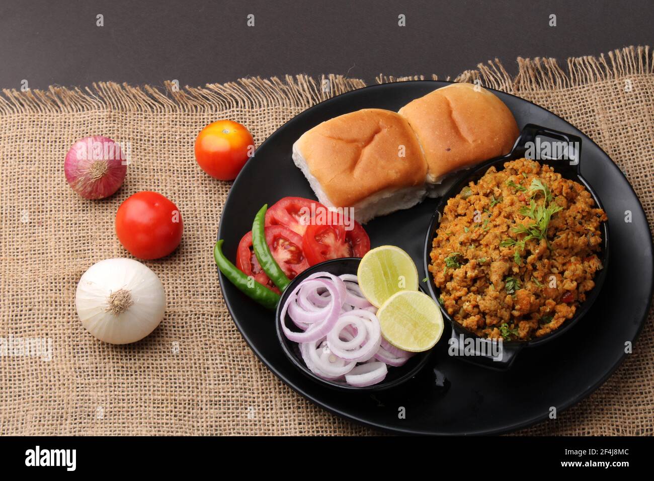 Masala Anda Bhurji or Spicy Indian scrambled eggs with bread or Bun Pav ...