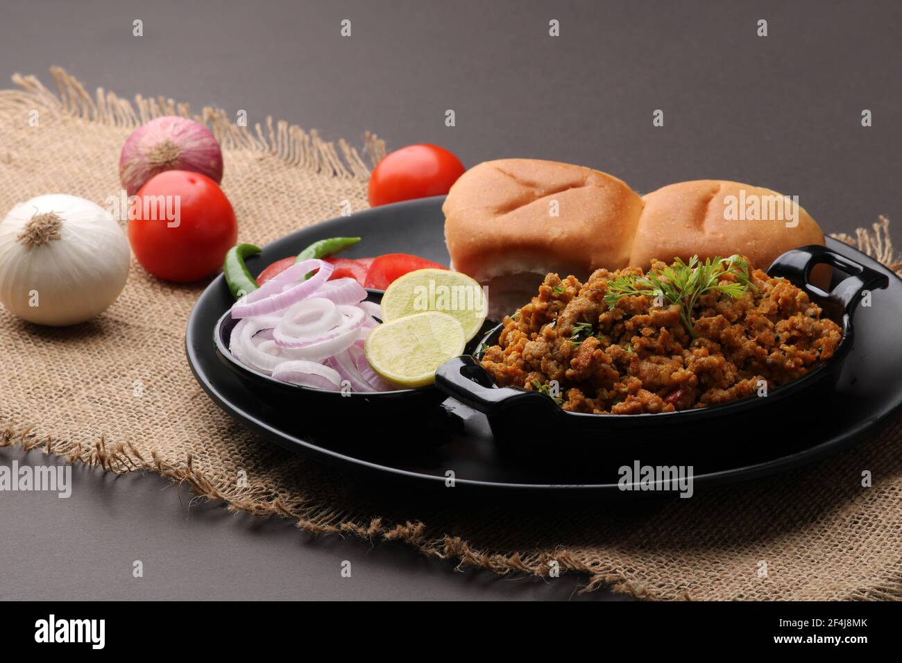 Masala Anda Bhurji or Spicy Indian scrambled eggs with bread or Bun Pav ...