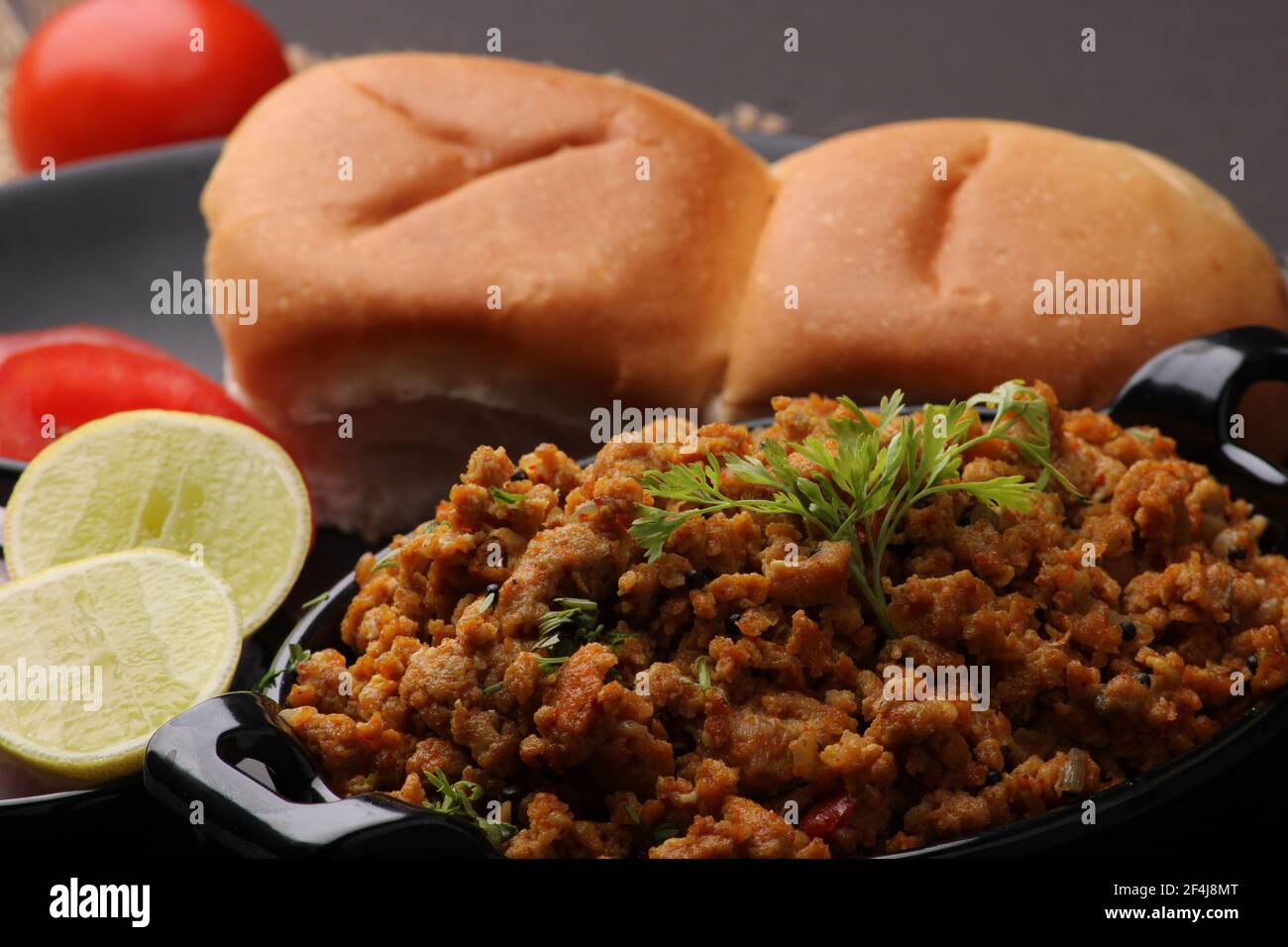 Masala Anda Bhurji or Spicy Indian scrambled eggs with bread or Bun Pav ...
