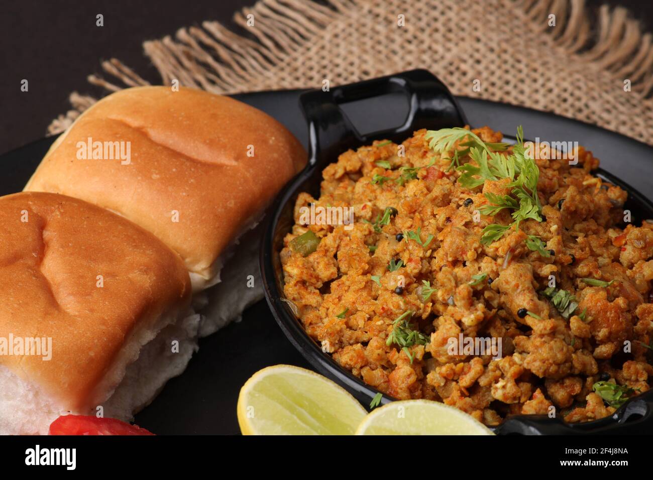 Masala Anda Bhurji or Spicy Indian scrambled eggs with bread or Bun Pav ...