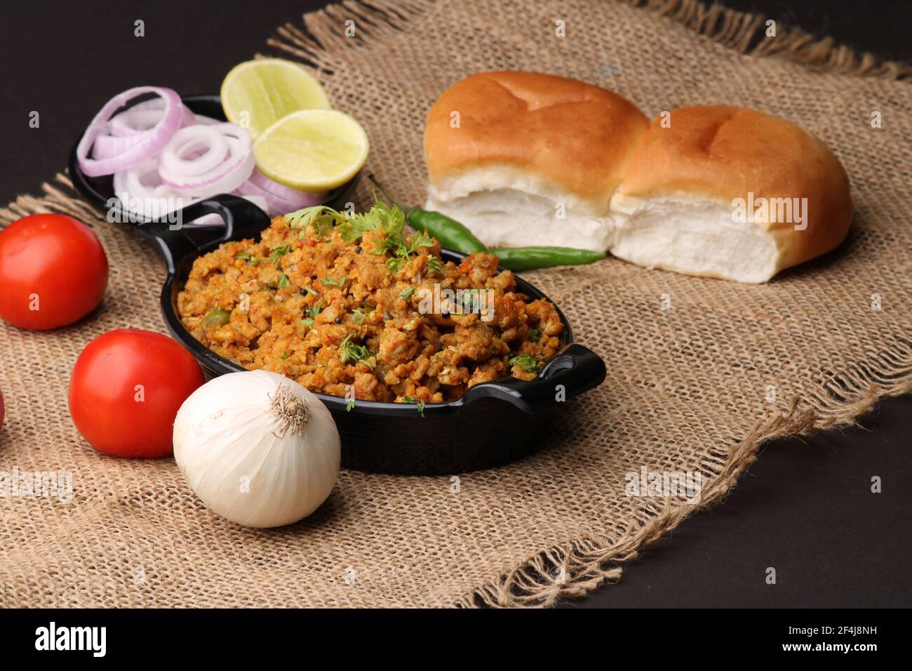Masala Anda Bhurji or Spicy Indian scrambled eggs with bread or Bun Pav ...