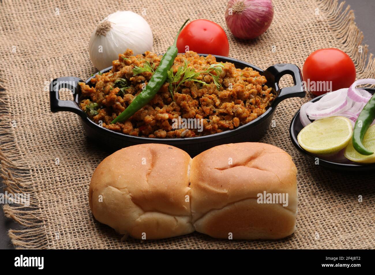 Masala Anda Bhurji or Spicy Indian scrambled eggs with bread or Bun Pav ...