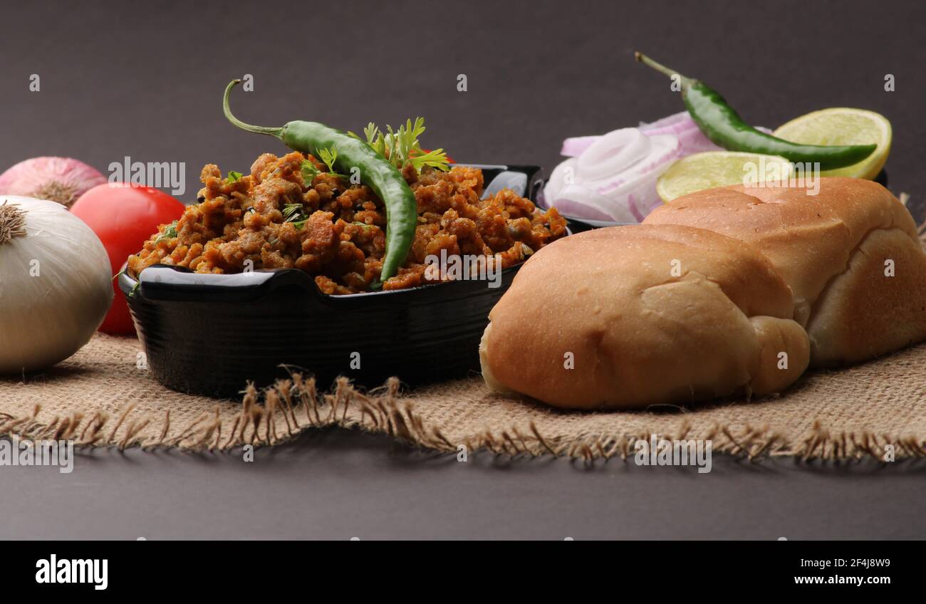 Masala Anda Bhurji or Spicy Indian scrambled eggs with bread or Bun Pav ...