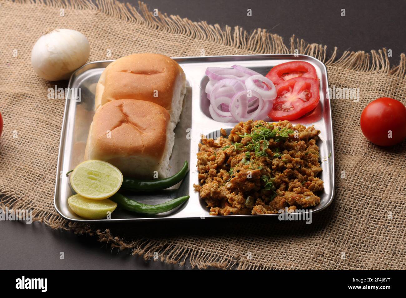 Masala Anda Bhurji or Spicy Indian scrambled eggs with bread or Bun Pav ...