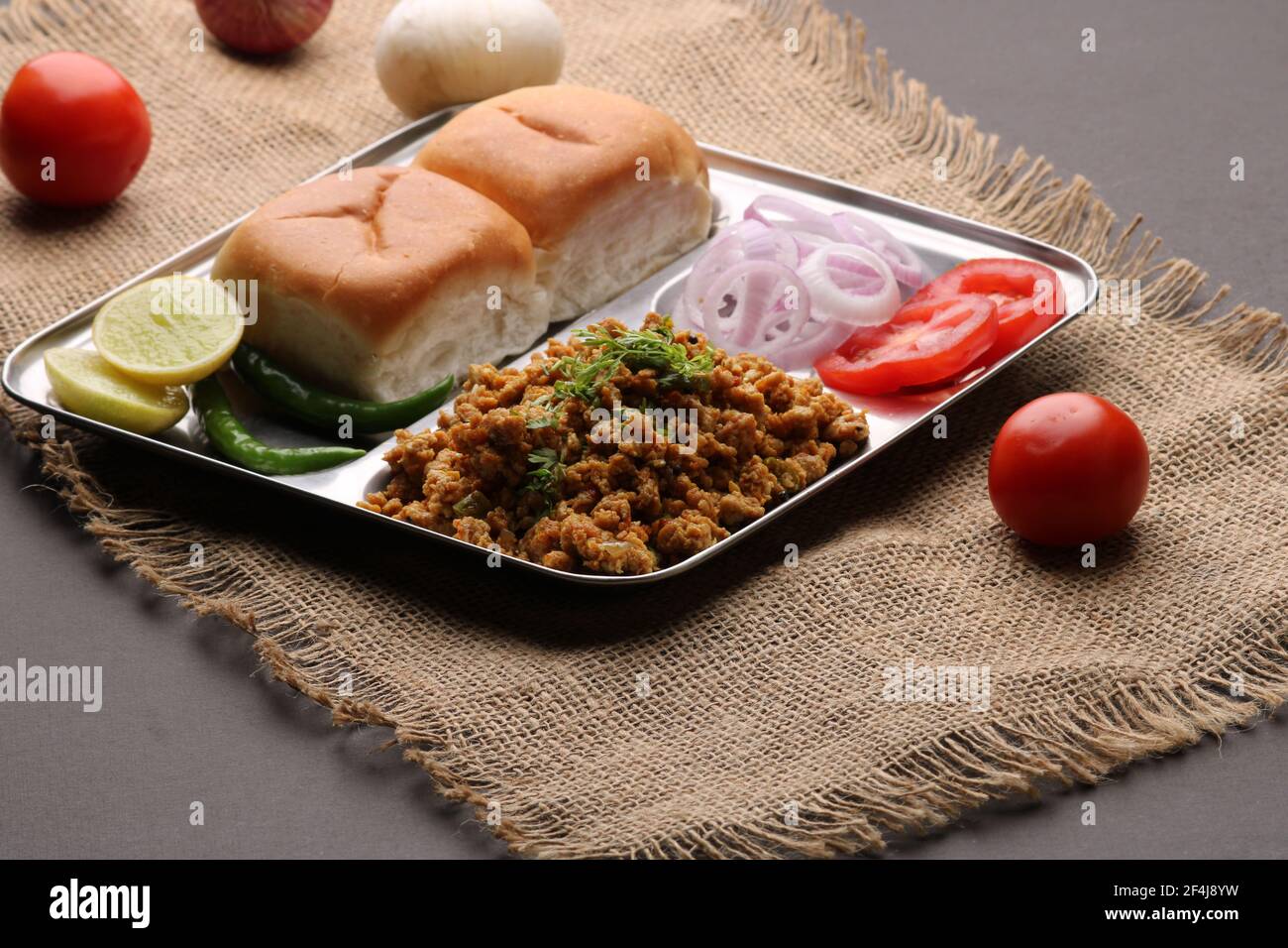 Masala Anda Bhurji or Spicy Indian scrambled eggs with bread or Bun Pav ...