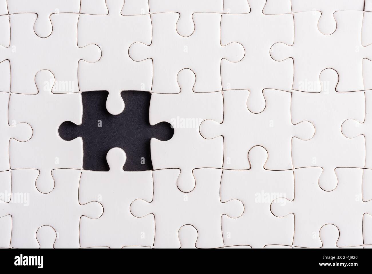 Top view flat lay of paper plain white jigsaw puzzle game texture ...