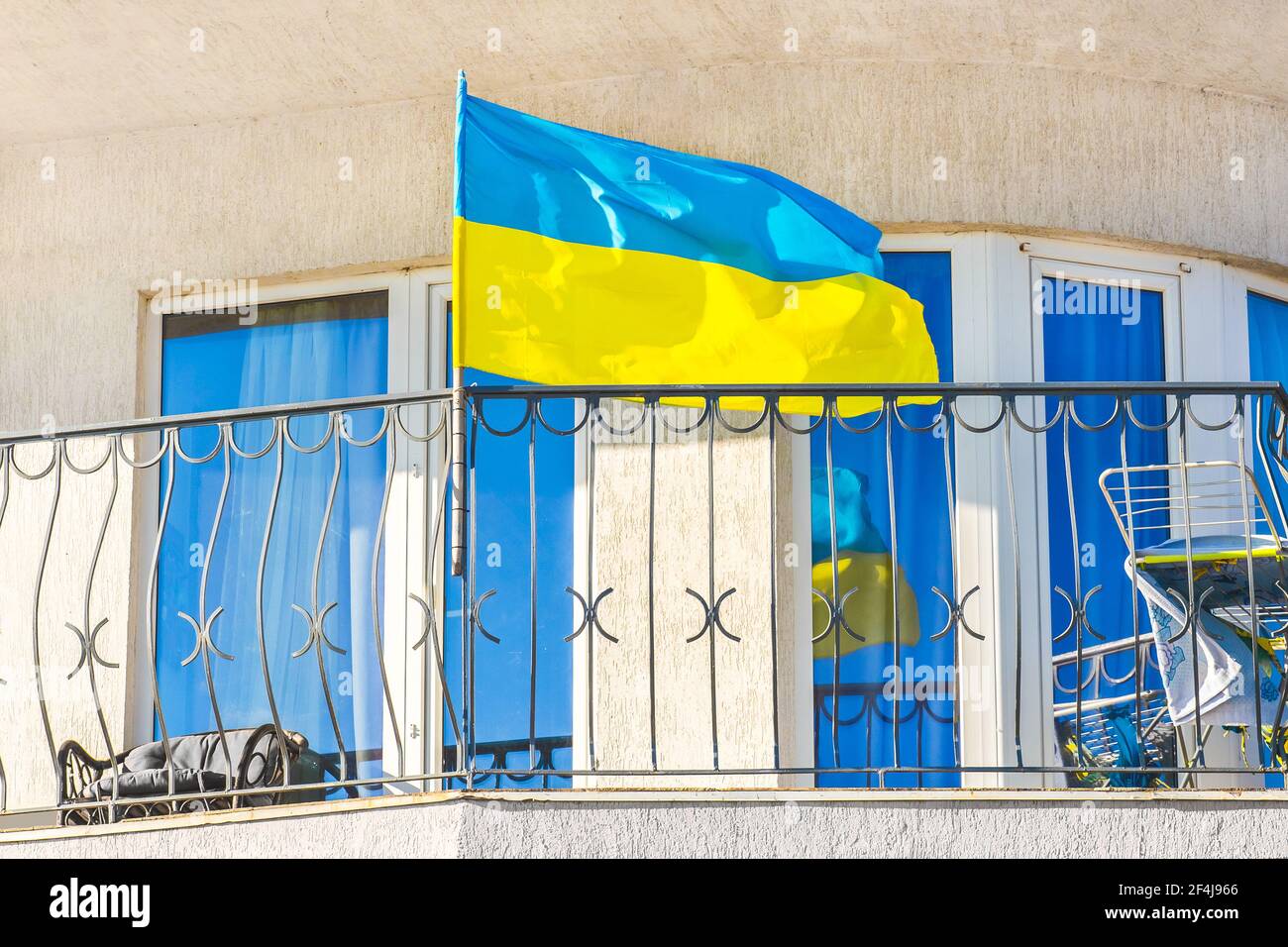 National flag of Ukraine on the hotel balcony. Patriotism concept Stock ...