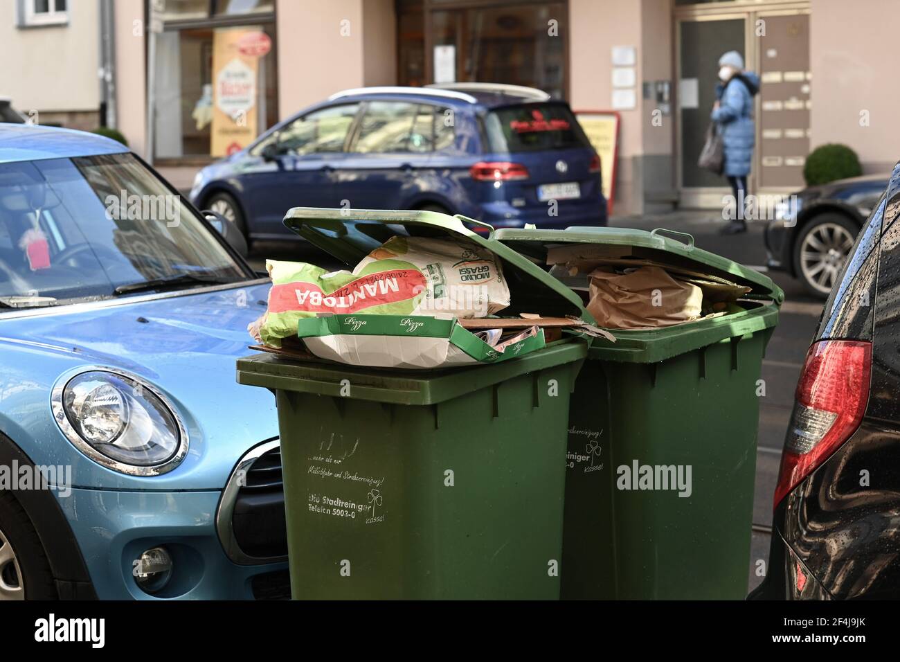 Kassel, Germany. 16th Mar, 2021. Full paper bins wait by the street to ...