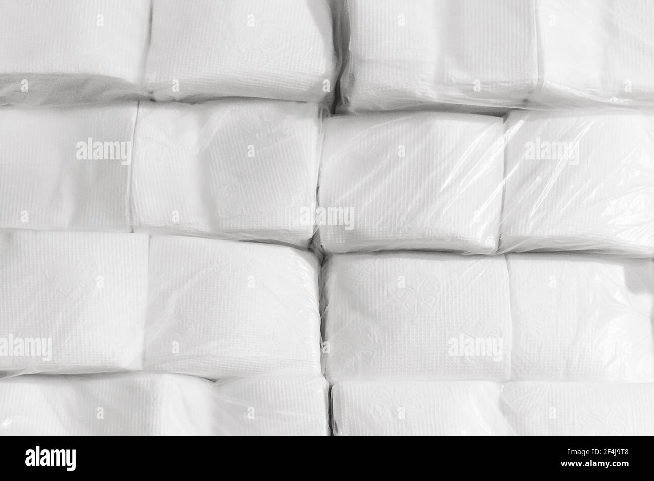 Pile of white wrapped paper napkins in warehouse background Stock Photo ...