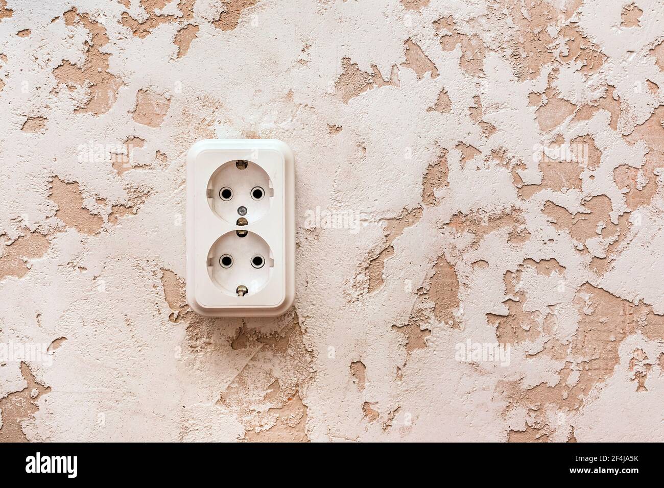 White double power socket on plaster wall in modern room interior Stock ...