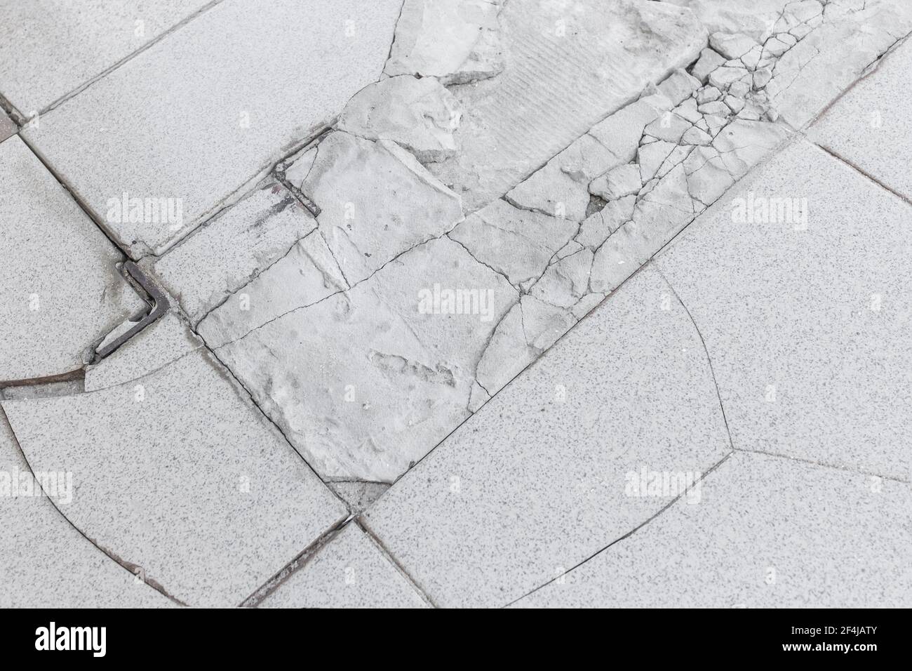 Old gray broken tile floor construction repair background, renovation ...