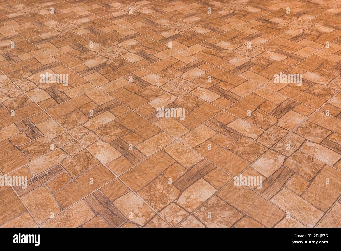 Brown tile floor with abstract pattern of stone surface texture ...