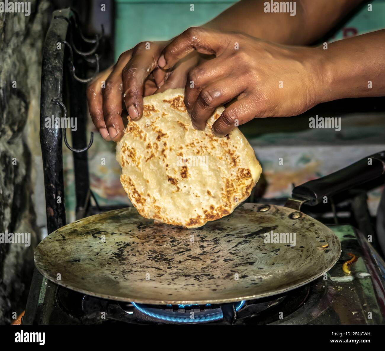 Baking national cakes Puri on the island of Sri Lanka Stock Photo - Alamy