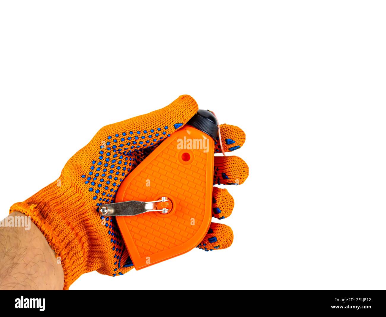 Chalk thread for marking the surface of the walls in the hand of the ...