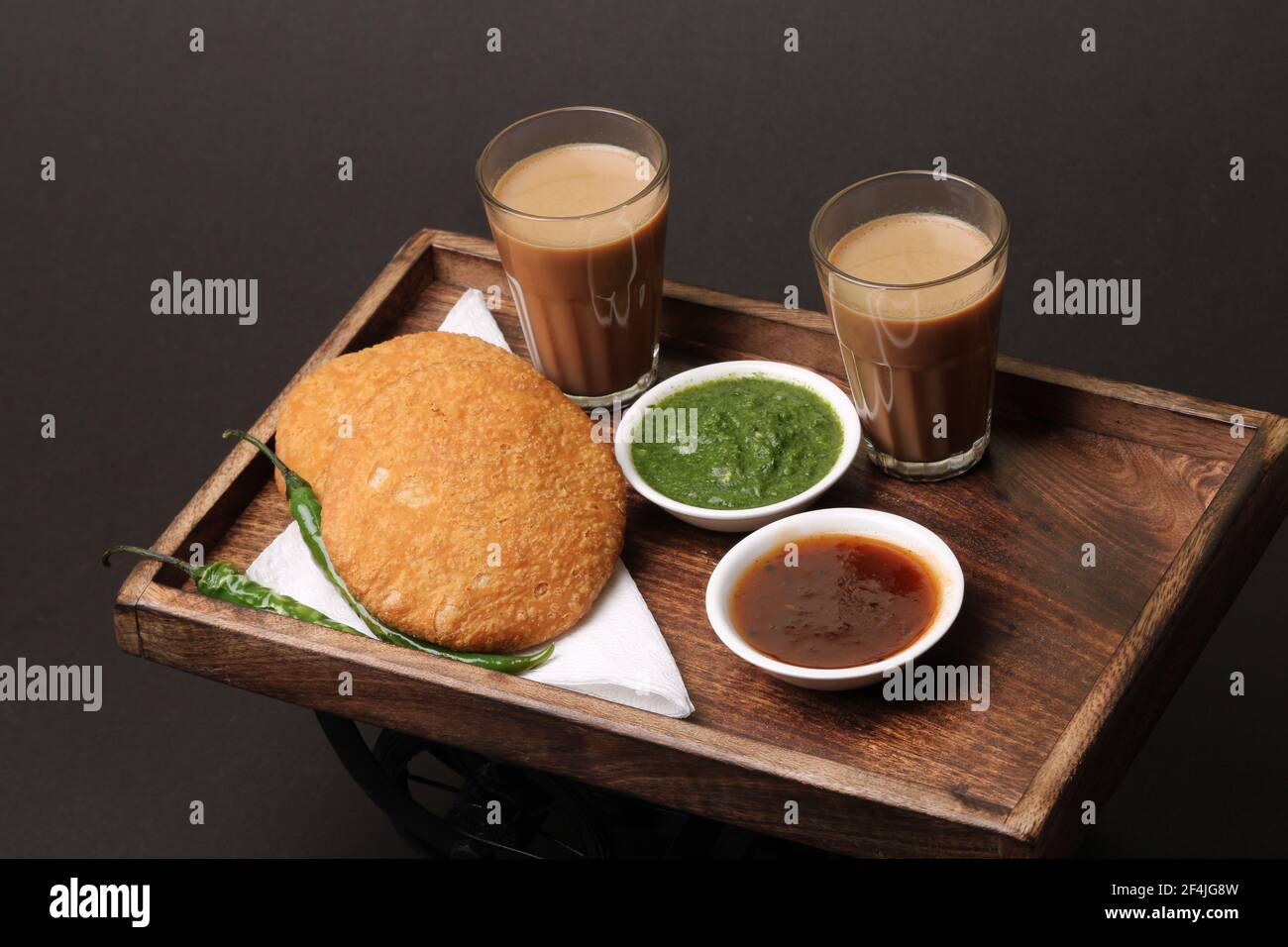 Indian snakes food kachouri or kachoudi kachori served with masala or ...