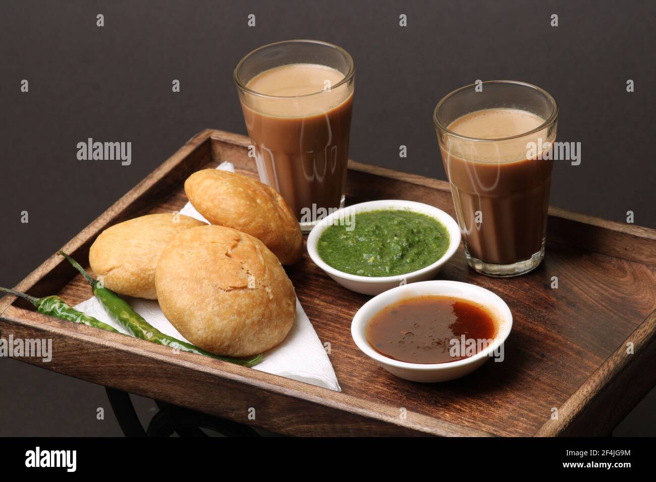 Indian snakes food kachouri or kachoudi kachori served with masala or ...