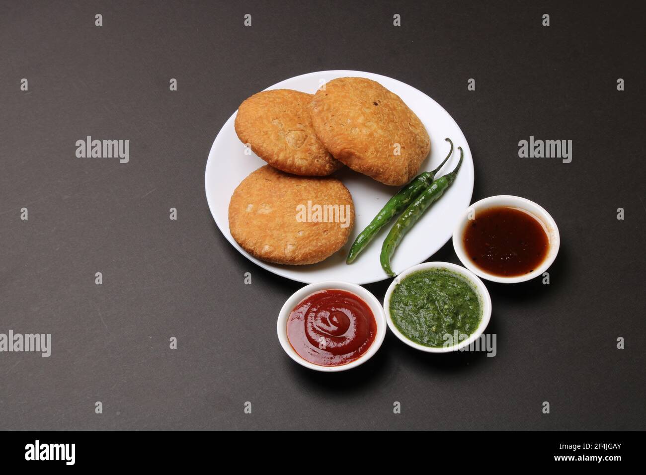 Indian snakes food kachouri or kachoudi kachori served with tamarind ...