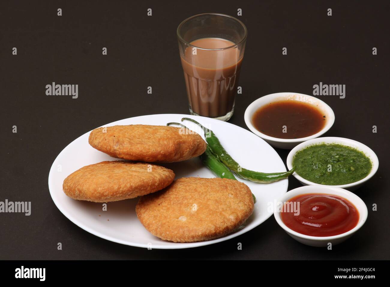 Indian snakes food kachouri or kachoudi kachori served with masala or ...