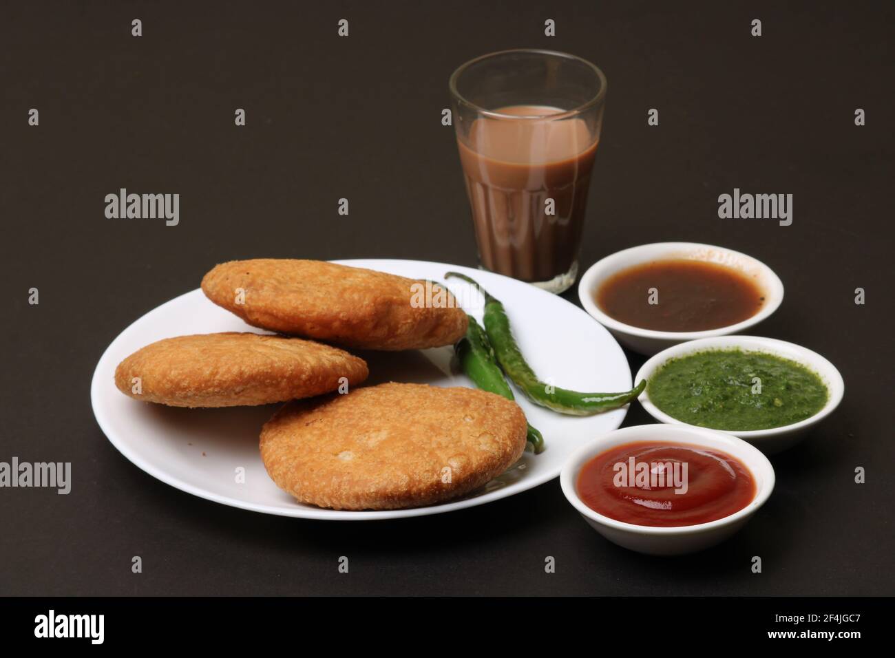 Indian snakes food kachouri or kachoudi kachori served with masala or ...