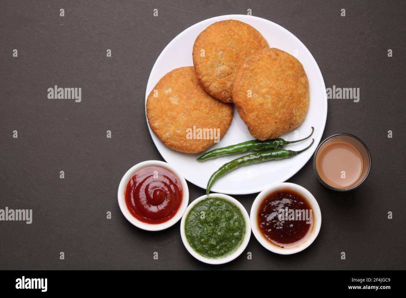 Indian snakes food kachouri or kachoudi kachori served with masala or ...