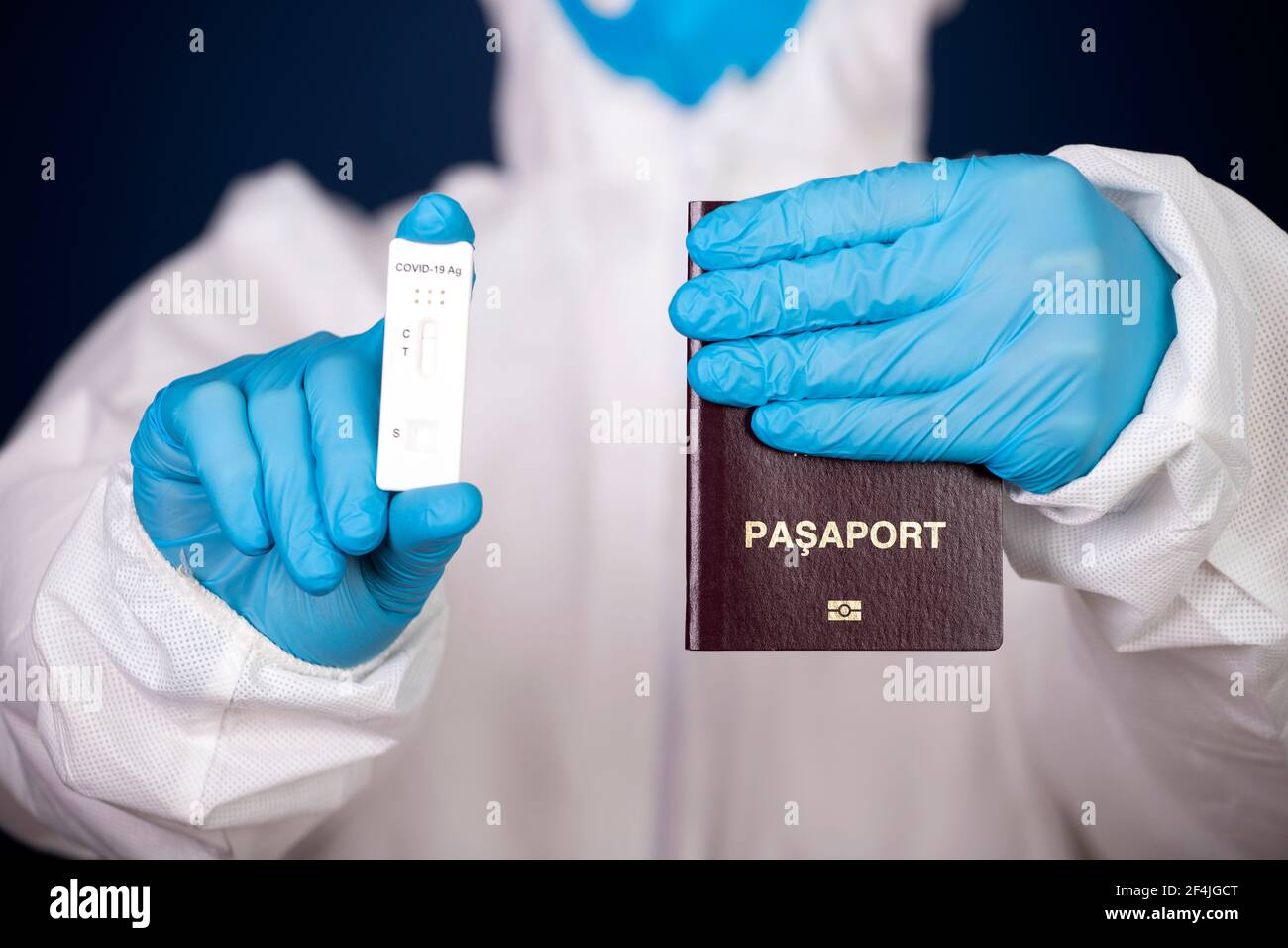 Doctor holding passport and negative covid-19 ( rapid antigen SARS-CoV ...